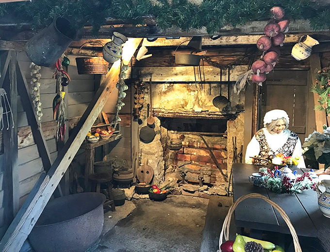 Colonial cooking comes to life in this rustic kitchen, where cast iron pots hang ready above the hearth and dried herbs dangle from ancient beams.