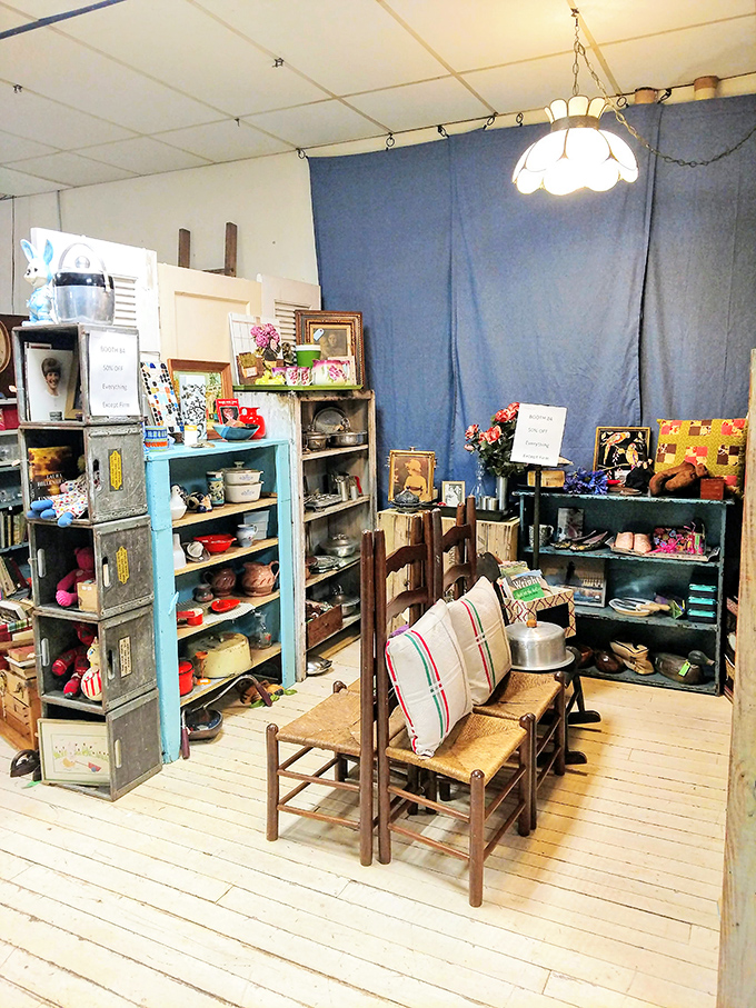 This cozy kitchen corner showcases vintage cookware and furnishings that evoke Sunday dinners at grandma's house, complete with phantom pie aromas.