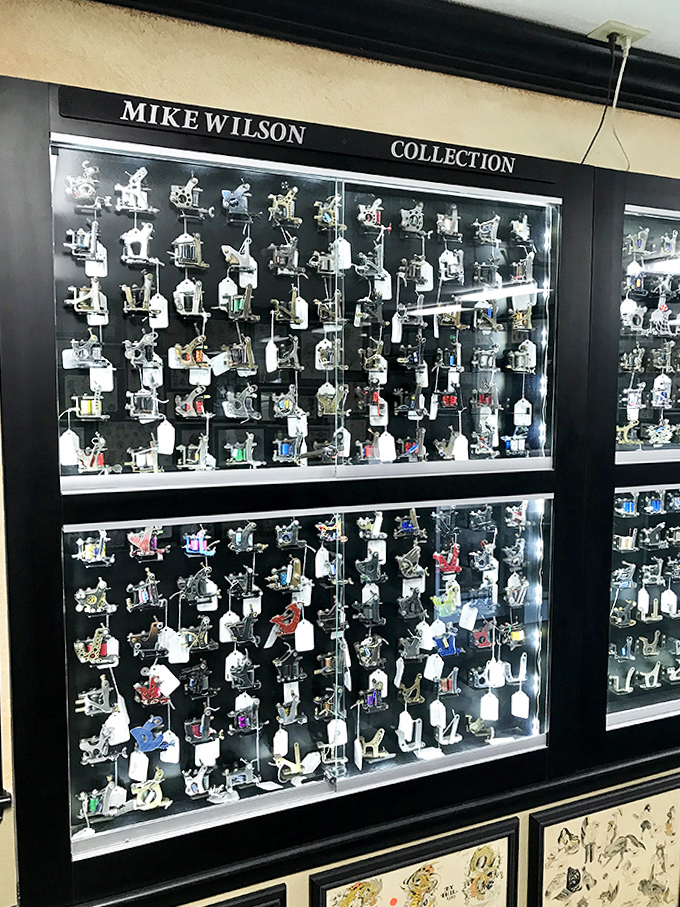 The Mike Wilson Collection showcases dozens of tattoo machines, each one a small mechanical marvel of artistic innovation.