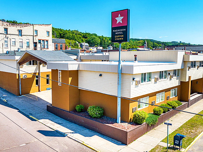 The Magnuson Hotel Copper Crown stands ready to welcome weary travelers with its distinctive sign guiding the way.