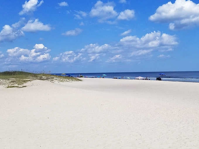 Main Beach's pristine sands stretch invitingly toward the Atlantic, offering ample room for castle architects and shell collectors alike.