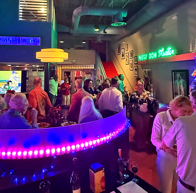 Film festival attendees gather in the colorfully lit lounge, where the conversation about cinema is as vibrant as the d&eacute;cor.