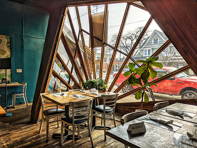 Those dramatic fan-shaped windows aren't just architectural showpieces &ndash; they frame the outside world like living paintings while you dine.