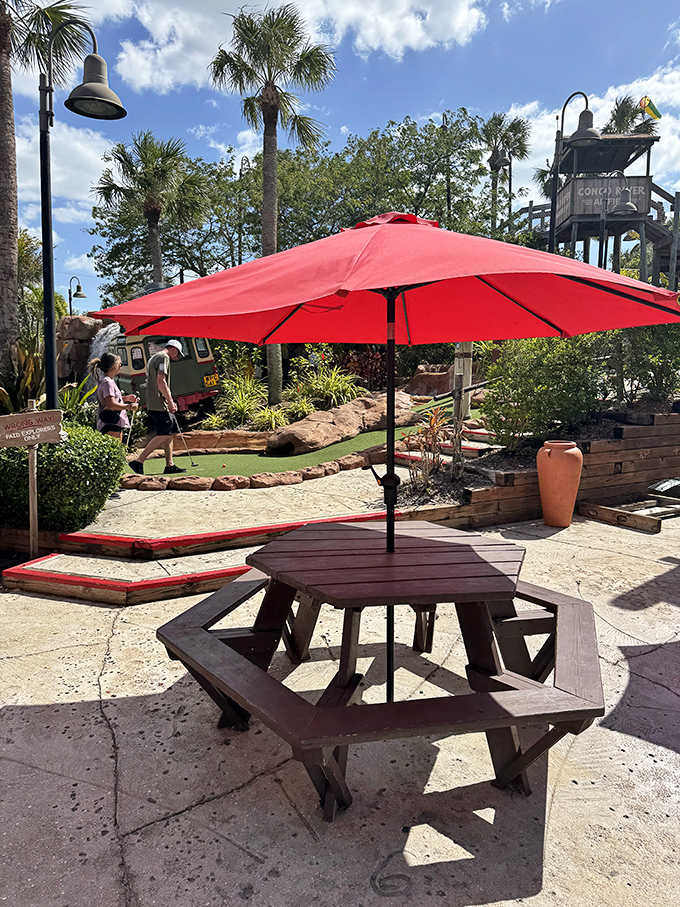 A shaded picnic area offers respite between rounds, perfect for strategizing your approach to that tricky 14th hole.