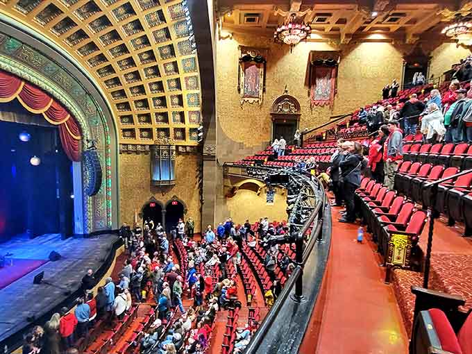 The red velvet curtain stands ready to reveal another night of entertainment, having risen and fallen on countless performances throughout the decades.