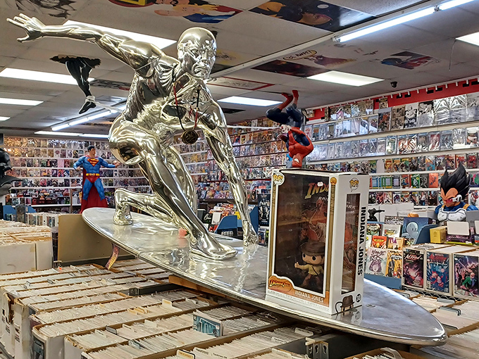 The Silver Surfer glides majestically above comic boxes, his metallic finish catching light like a disco ball at the universe's coolest party.