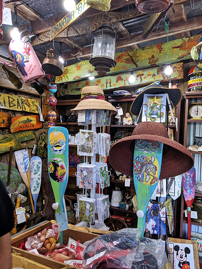 The interior reveals a treasure trove of maritime memorabilia, hand-painted paddles, and souvenirs that blur the line between art and artifact.