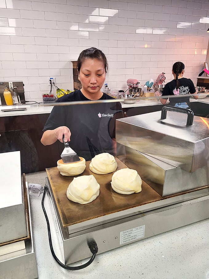 Behind the scenes, skilled hands prepare the famous Kumo pancakes, each one requiring patience and precision to achieve that signature cloud-like texture.
