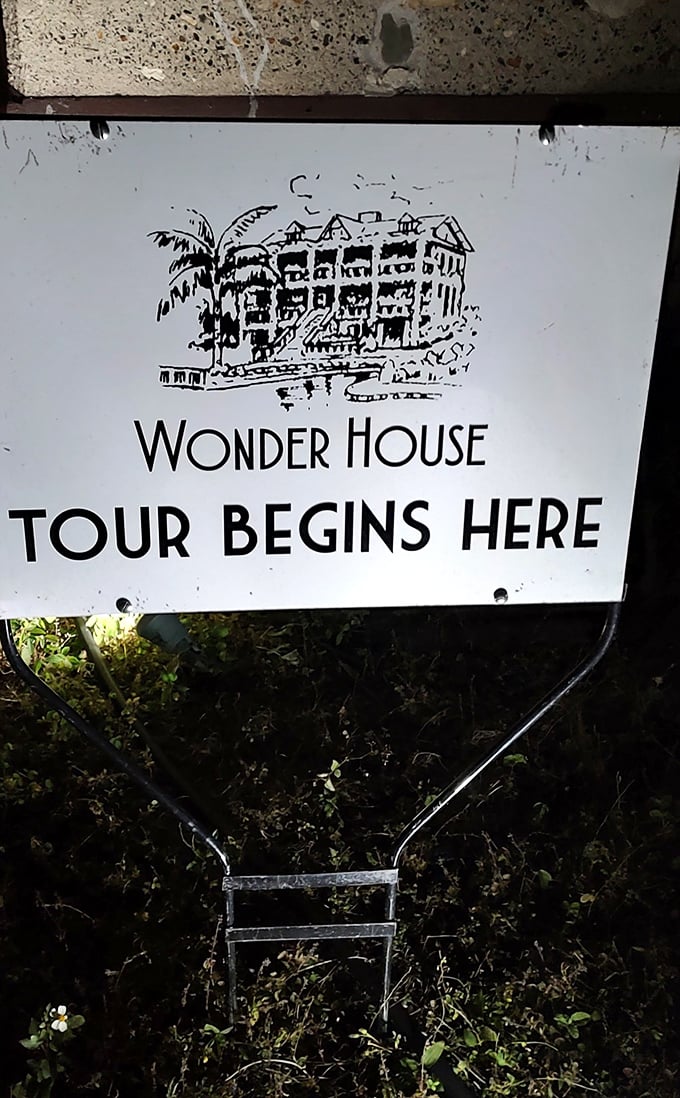 The "Tour Begins Here" sign might be the most optimistic invitation in Florida – buckle up for architectural wonderment, folks.