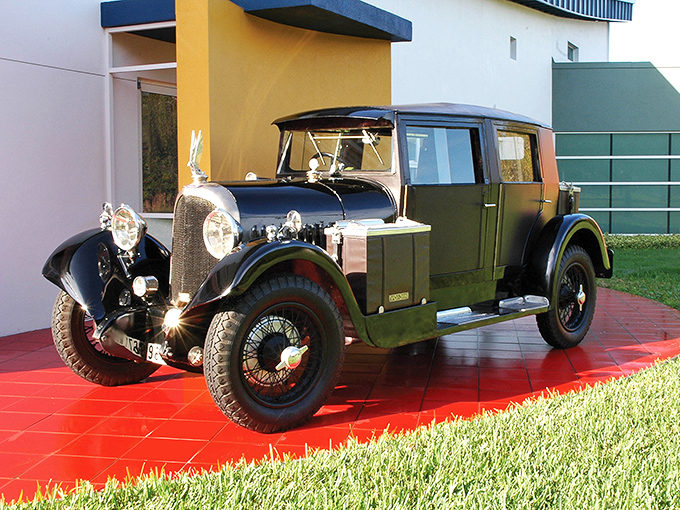 This vintage French automobile basks in the Florida sunshine, its two-tone elegance a testament to European automotive artistry.
