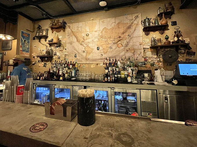 The massive map behind the bar isn't just decoration&mdash;it's an invitation to travel the world through spirits, with each bottle promising exotic flavors.