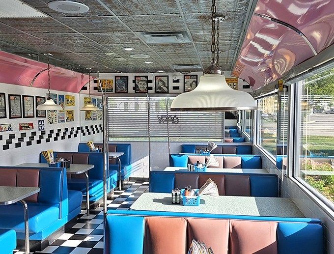 Sliding into these booths feels like entering a Technicolor movie set, where conversations flow as easily as the bottomless coffee.