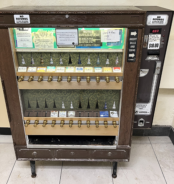 A vintage cigarette vending machine stands as a charming relic of bygone days. This conversation piece sparks nostalgic discussions among diners.