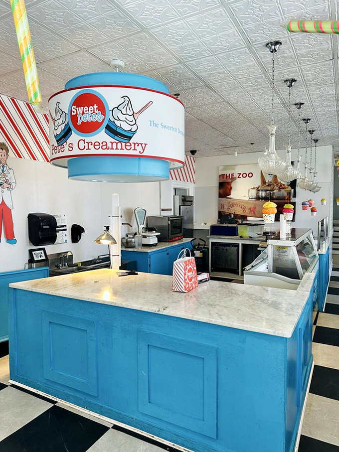 The bright blue counter and classic soda fountain setup create a retro ice cream parlor straight from a Norman Rockwell painting.