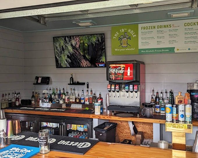 Behind this well-stocked bar, mixologists craft beverages that elevate your mini golf game from amateur to slightly-tipsy professional.