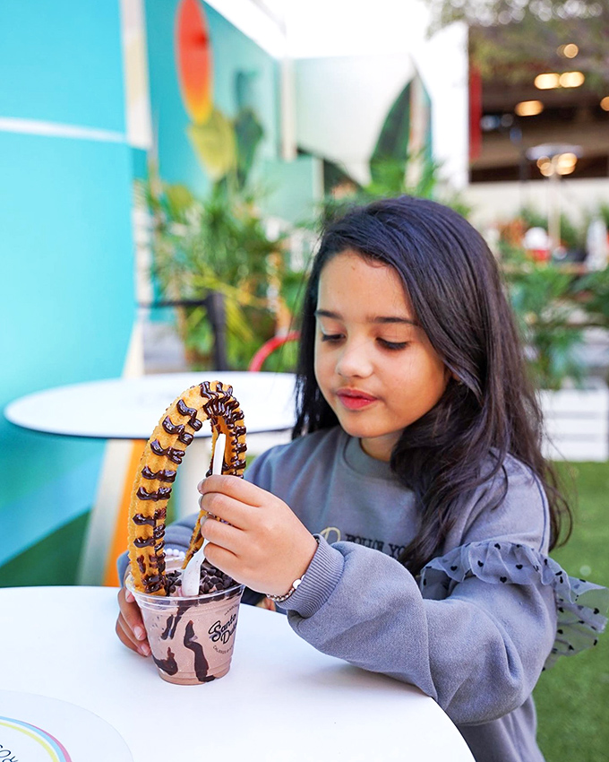 The colorful outdoor seating area invites guests to linger and savor their sweet creations under Miami's perpetually perfect skies.