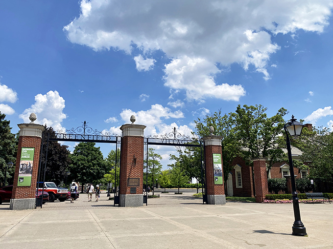 The grand entrance gates welcome time-travelers with architectural authority, marking the threshold between now and then.