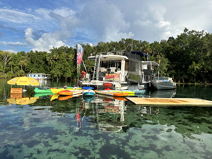 A floating vendor offers colorful kayaks for rent, bringing a splash of rainbow hues to the already picture-perfect spring.