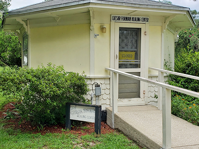 The Caesar Forman Healing Center offers spiritual remedies, though the "CLOSED" sign suggests even metaphysical practitioners need lunch breaks.