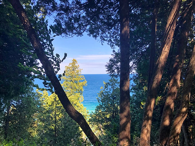 Hikers make their way up to Arch Rock, each bend in the path building anticipation for the grand reveal ahead.