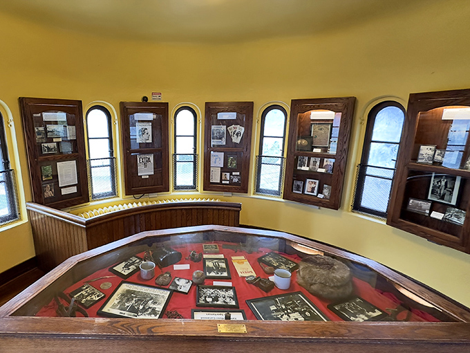 The castle's circular tower room displays Curwood memorabilia like spokes on a wheel, each artifact telling part of his remarkable story.