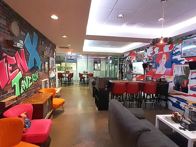 The lounge area's vibrant graffiti wall and comfortable seating create a perfect spot for reminiscing about favorite '90s moments.