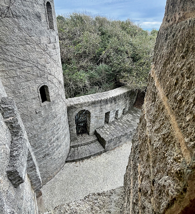 From this vantage point between towers, visitors glimpse the architectural complexity that makes this modern castle feel authentically ancient.