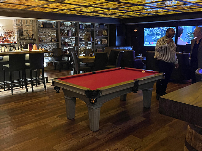 The pool table offers a genteel diversion between cocktails, harking back to an era when entertainment didn't require a charging cable.