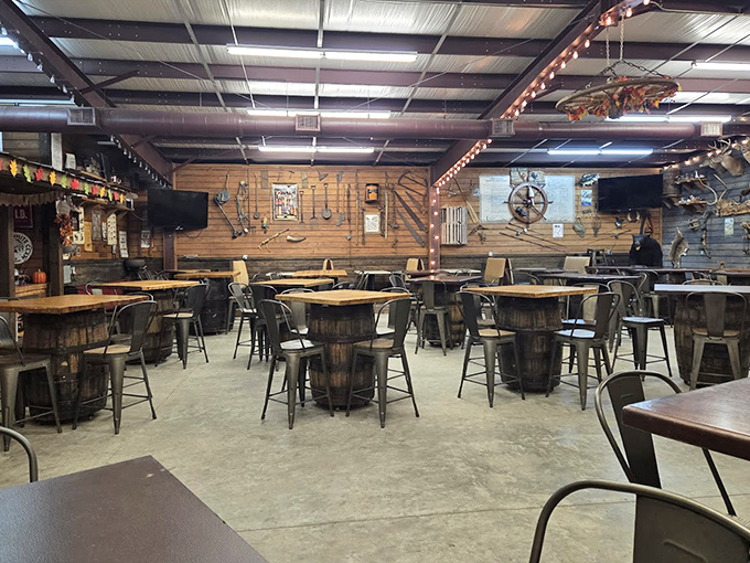 The dining area invites lingering conversations &ndash; wooden barrel tables and metal chairs create gathering spots where strangers become friends over good food.