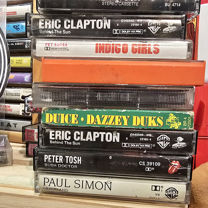 Cassette time capsules stacked with care &ndash; Eric Clapton, Indigo Girls, and Paul Simon waiting patiently to soundtrack your next nostalgic road trip.