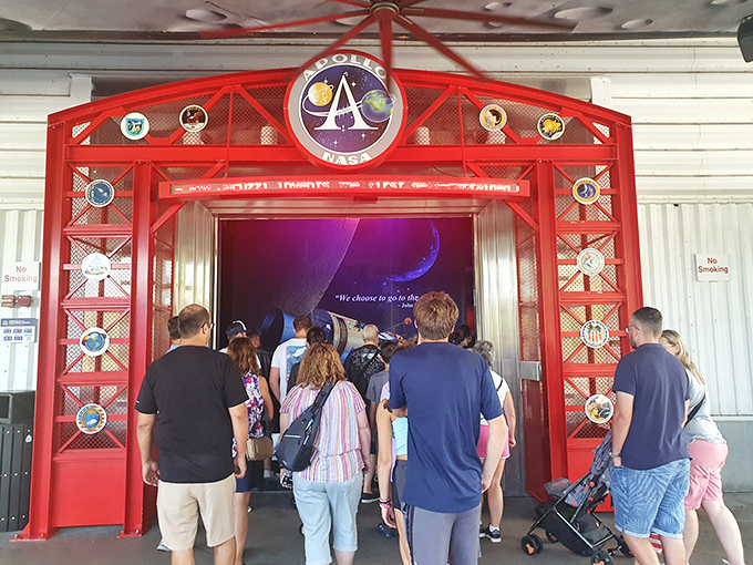 Visitors stream through the Apollo/Saturn V Center entrance, about to experience that rare moment when reality exceeds imagination in every possible way.