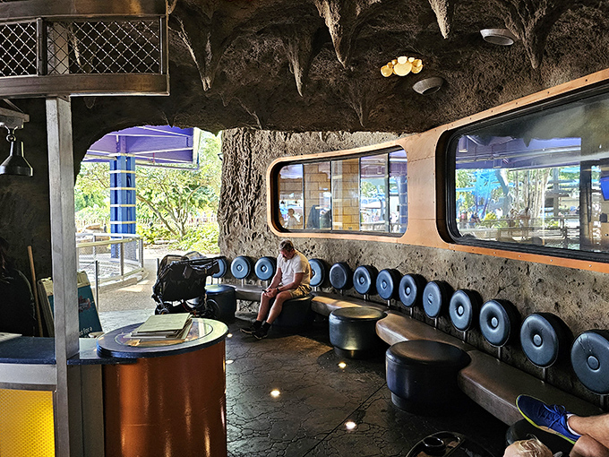The waiting area's cave-like design sets the underwater tone immediately, preparing visitors for the blue-hued dining adventure that awaits.