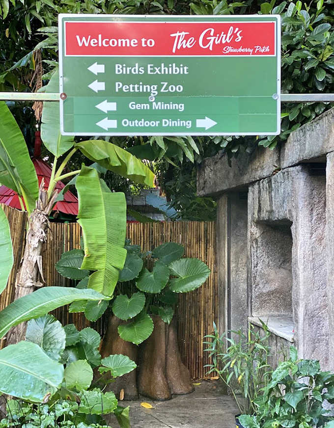 Directional signs guide visitors through this wonderland of attractions, from bird exhibits to gem mining, ensuring no magical experience goes undiscovered.