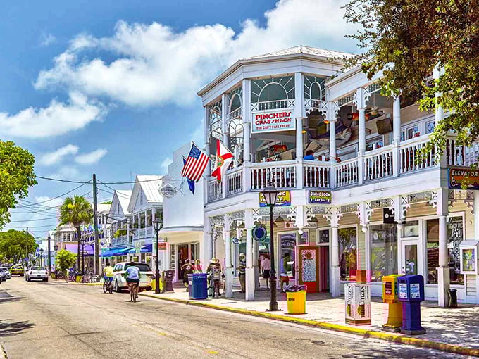 Key West's iconic Duval Street comes alive at sunset, with historic buildings housing everything from seafood restaurants to quirky souvenir shops.