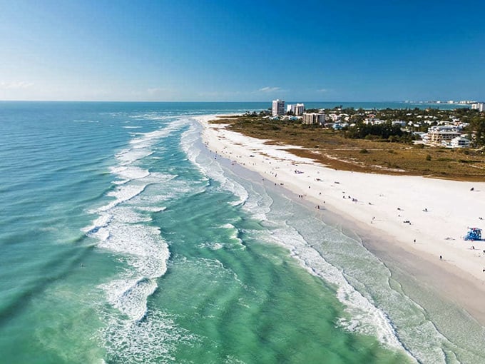 The island's unique geography creates perfect conditions for swimming, with calm waters and powder-soft sand.