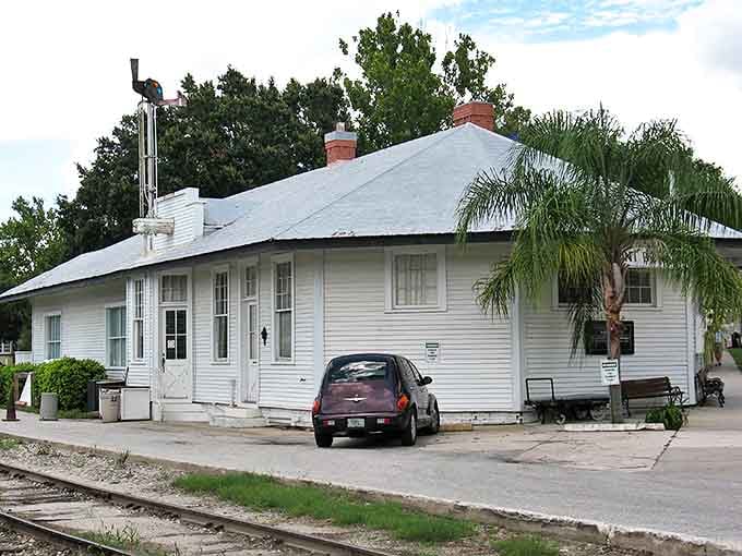 This humble white building once connected Mount Dora to the world, now preserved as a reminder of the town's railroad roots.
