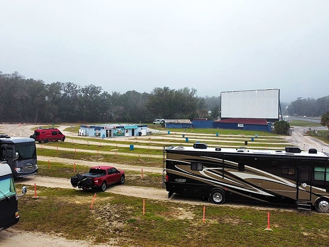From above, the drive-in reveals its careful organization &ndash; a temporary city of cars and campers united by the glow of storytelling.