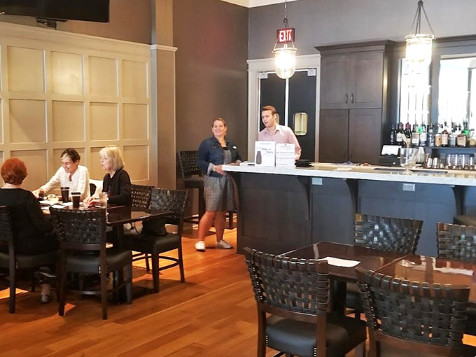 The elegant bar area invites patrons to enjoy pre-show drinks or intermission refreshments in sophisticated, vintage-inspired surroundings.