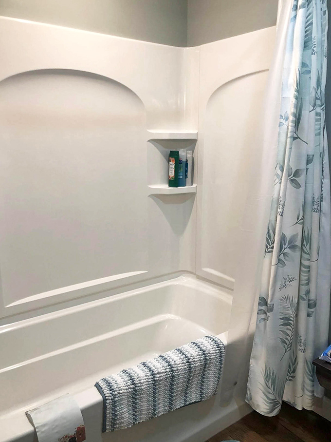 Even the bathroom continues the treehouse theme of simple elegance, with clean lines and thoughtful touches that elevate the everyday.