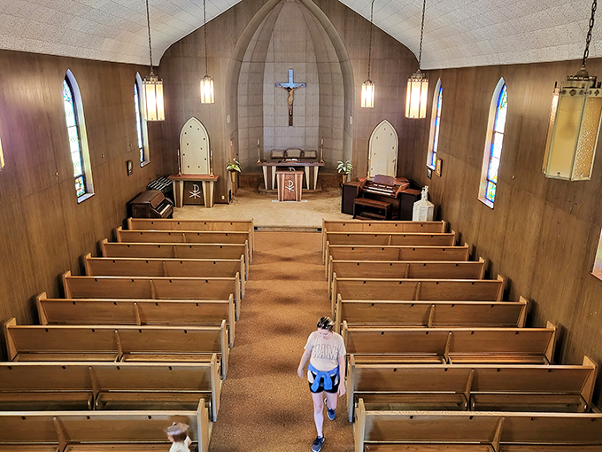 Church: Simple wooden pews face a modest altar, where generations gathered for life's most significant moments &ndash; no smartphone interruptions necessary.