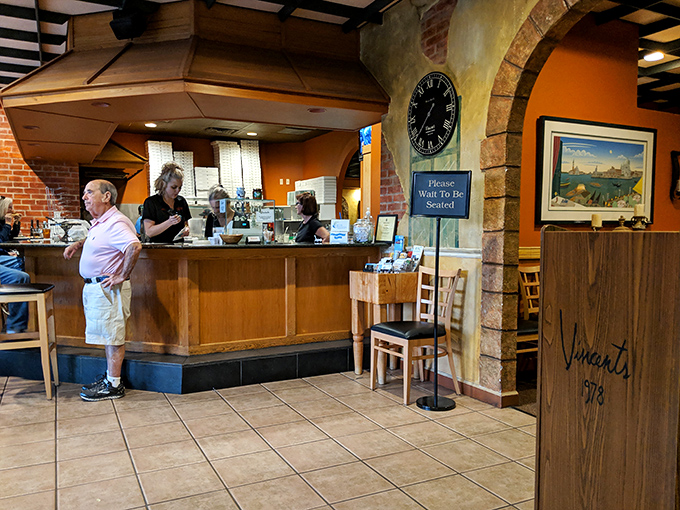 The welcoming counter where first-timers become regulars and regulars become family &ndash; the heart of Vincent's operation.