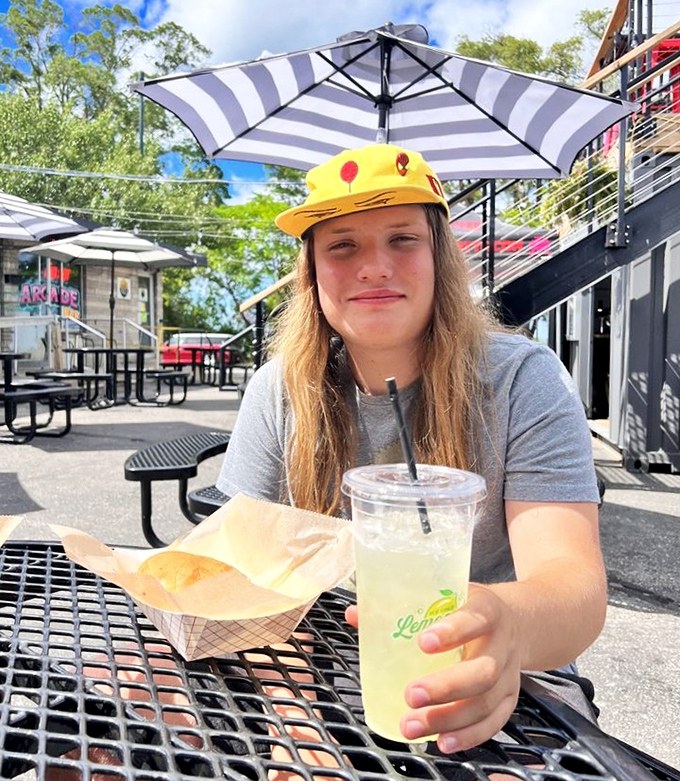 Outdoor refreshment awaits under striped umbrellas &ndash; the perfect respite when your button-mashing fingers need a well-deserved break.