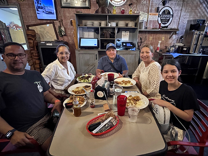 Happy diners enjoying the fruits of the sea, creating memories that will last longer than their sunburns.