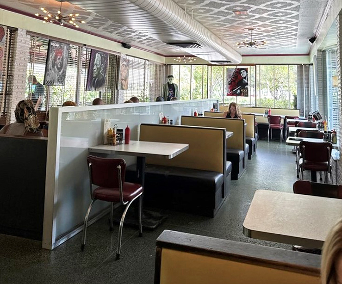 Classic booths invite intimate conversations while the pressed tin ceiling whispers stories of decades past to anyone who looks up.