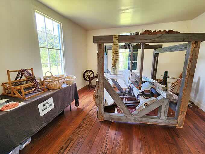 This antique loom stands as testament to the skilled labor of enslaved craftspeople whose handiwork supported the plantation economy.