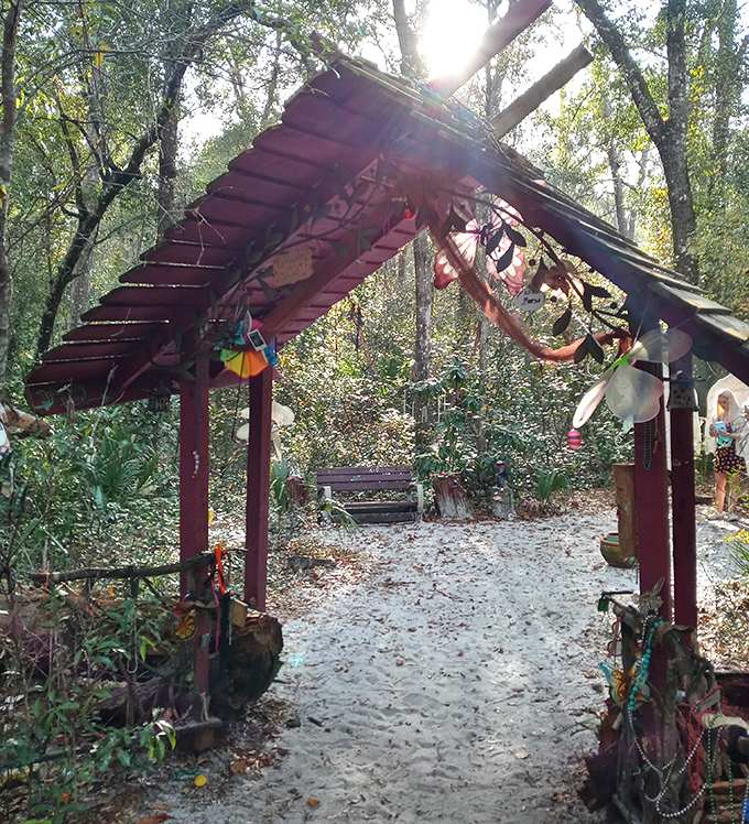 The enchanting Fairy Trail entrance invites visitors into a whimsical woodland realm where spiritual seekers leave trinkets and possibly their inhibitions behind.