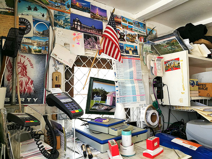 Postcards from around the world decorate the interior walls, evidence of the global appeal of this tiny postal anomaly.