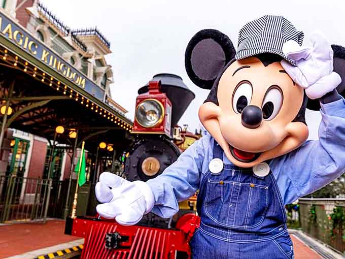 Where fantasy meets history: Mickey greets visitors beside the gleaming locomotive that represents Walt Disney's lifelong passion for trains.