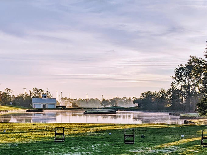 Early morning mist creates a magical atmosphere at the golf course, where even water hazards look invitingly serene.