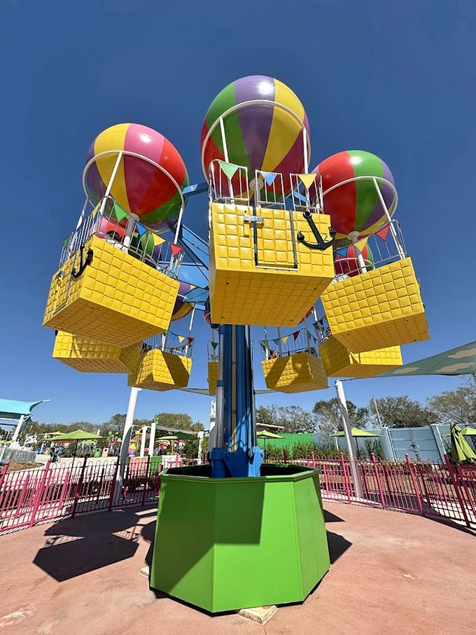 Peppa's Balloon Ride lifts families into the sky in colorful baskets – offering a gentle aerial adventure and bird's-eye views of the entire park.